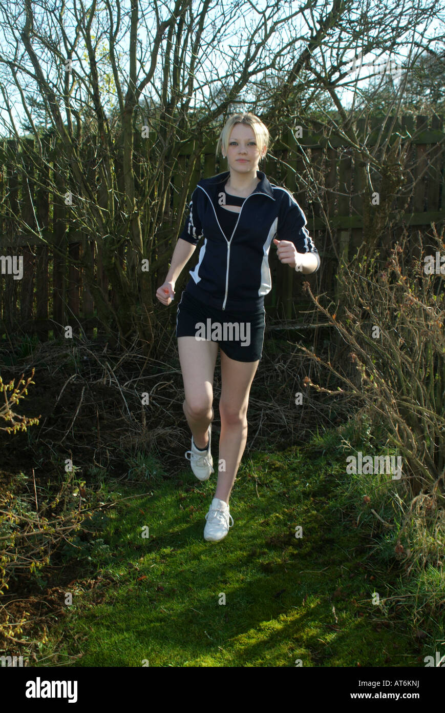 A female cross country runner in rough terrain Stock Photo - Alamy