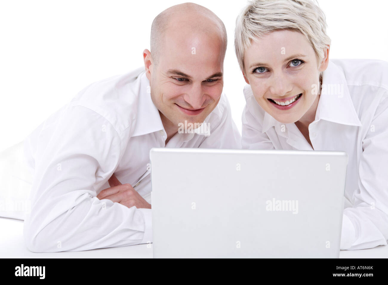 Young couple using laptop, portrait Stock Photo - Alamy