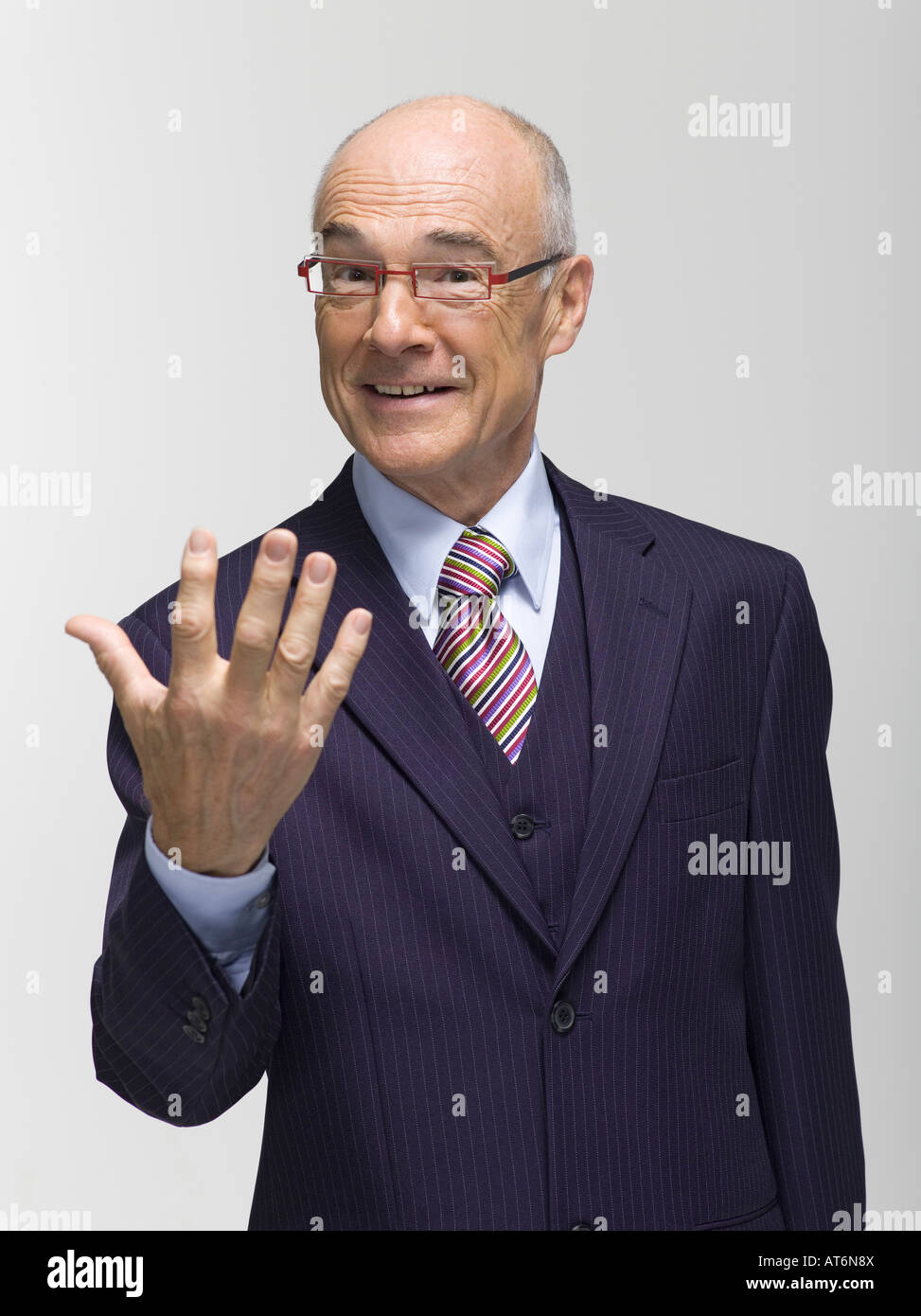 Businessman making hand gesture, portrait Stock Photo - Alamy