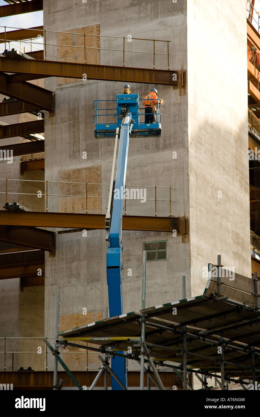 Workmen on a raised hydraulic inspection platform at the St Davids II ...