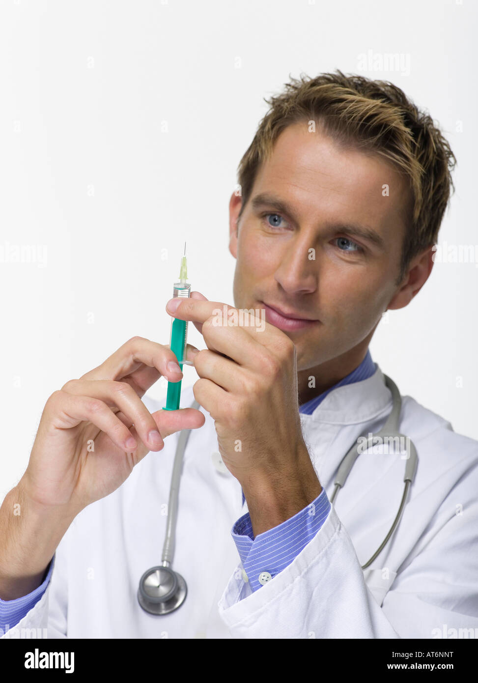 Male Doctor preparing syringe, portrait Stock Photo - Alamy