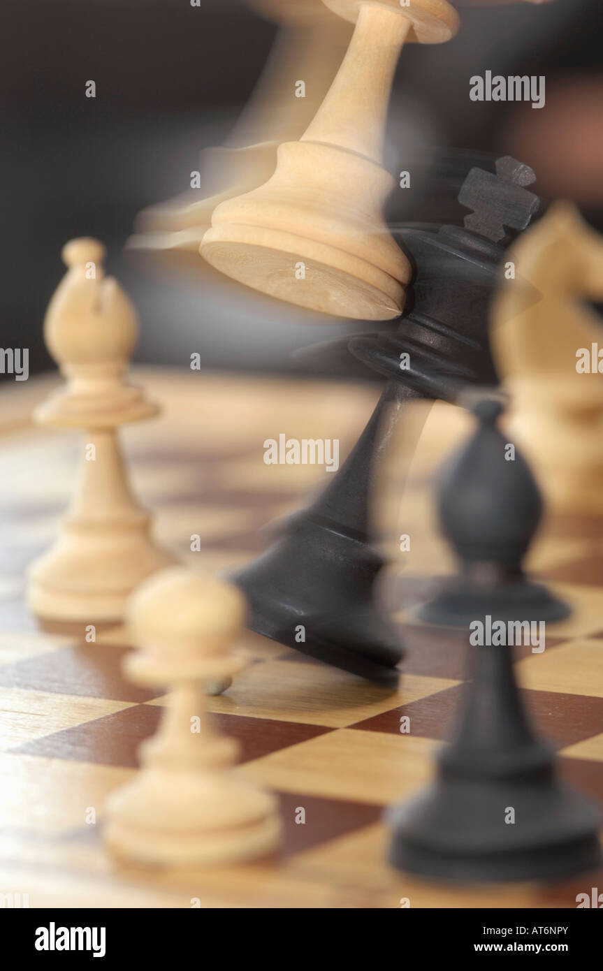 Chess pieces on board Stock Photo - Alamy