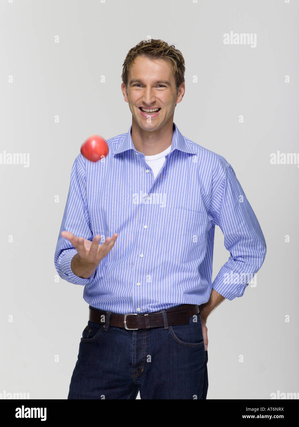 Man throwing apple hi-res stock photography and images - Alamy