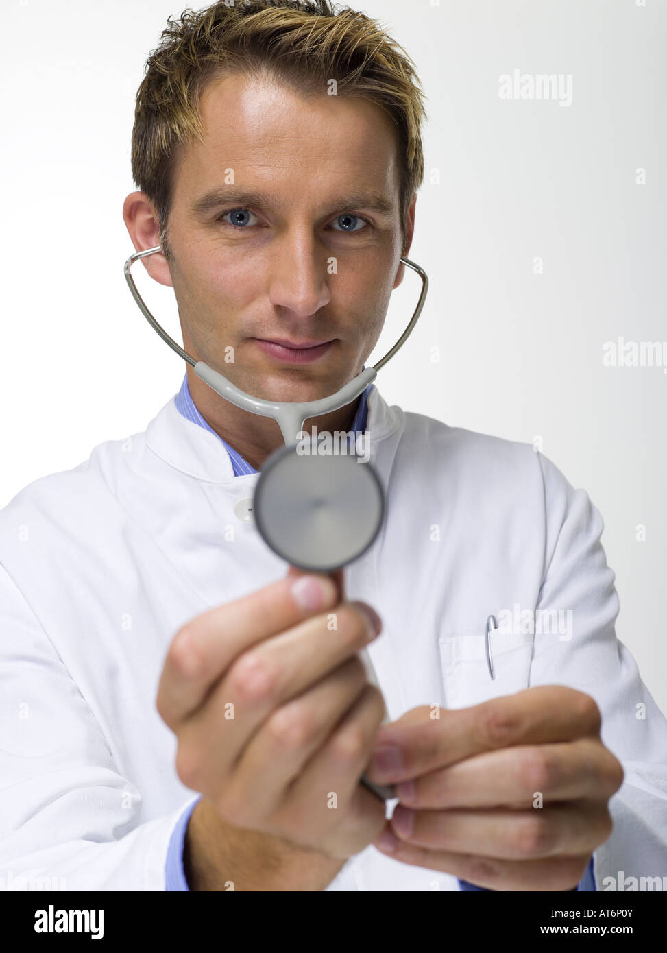 Male doctor holding stethoscope, close-up, portrait Stock Photo - Alamy