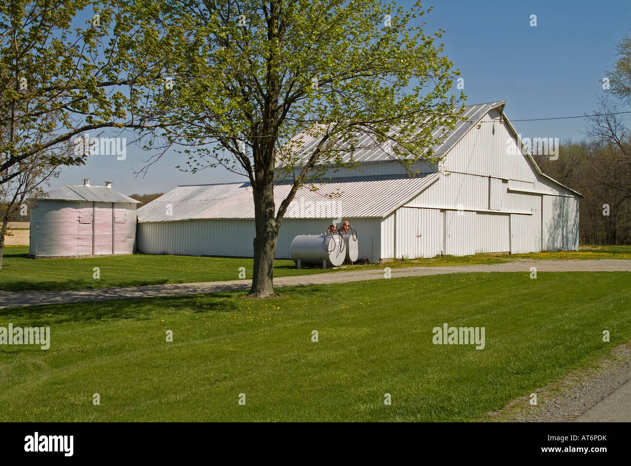Americana midwest farm with white barn and fuel tanks Stock Photo - Alamy