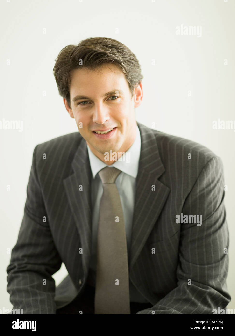 Young businessman smiling, portrait Stock Photo - Alamy