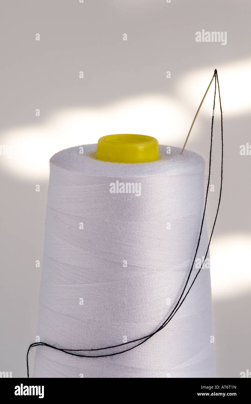 spools of white sewing thread Stock Photo - Alamy