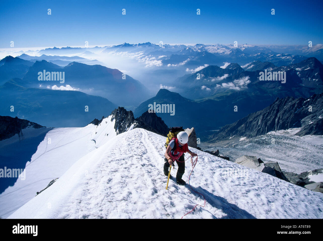 CLIMBER REACHING SUMMIT Stock Photo - Alamy