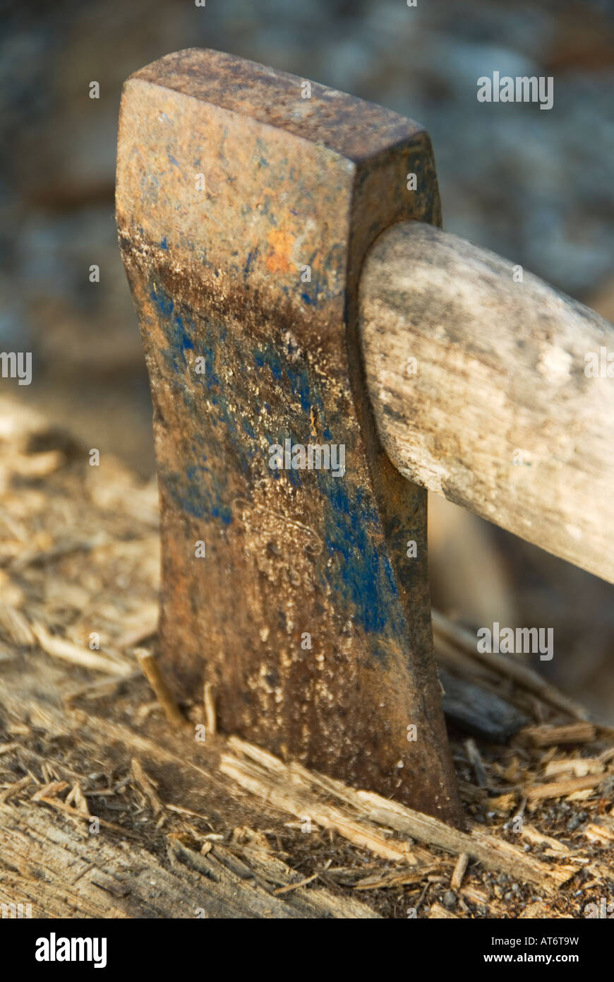 A hatchet buried in a block of wood Stock Photo - Alamy