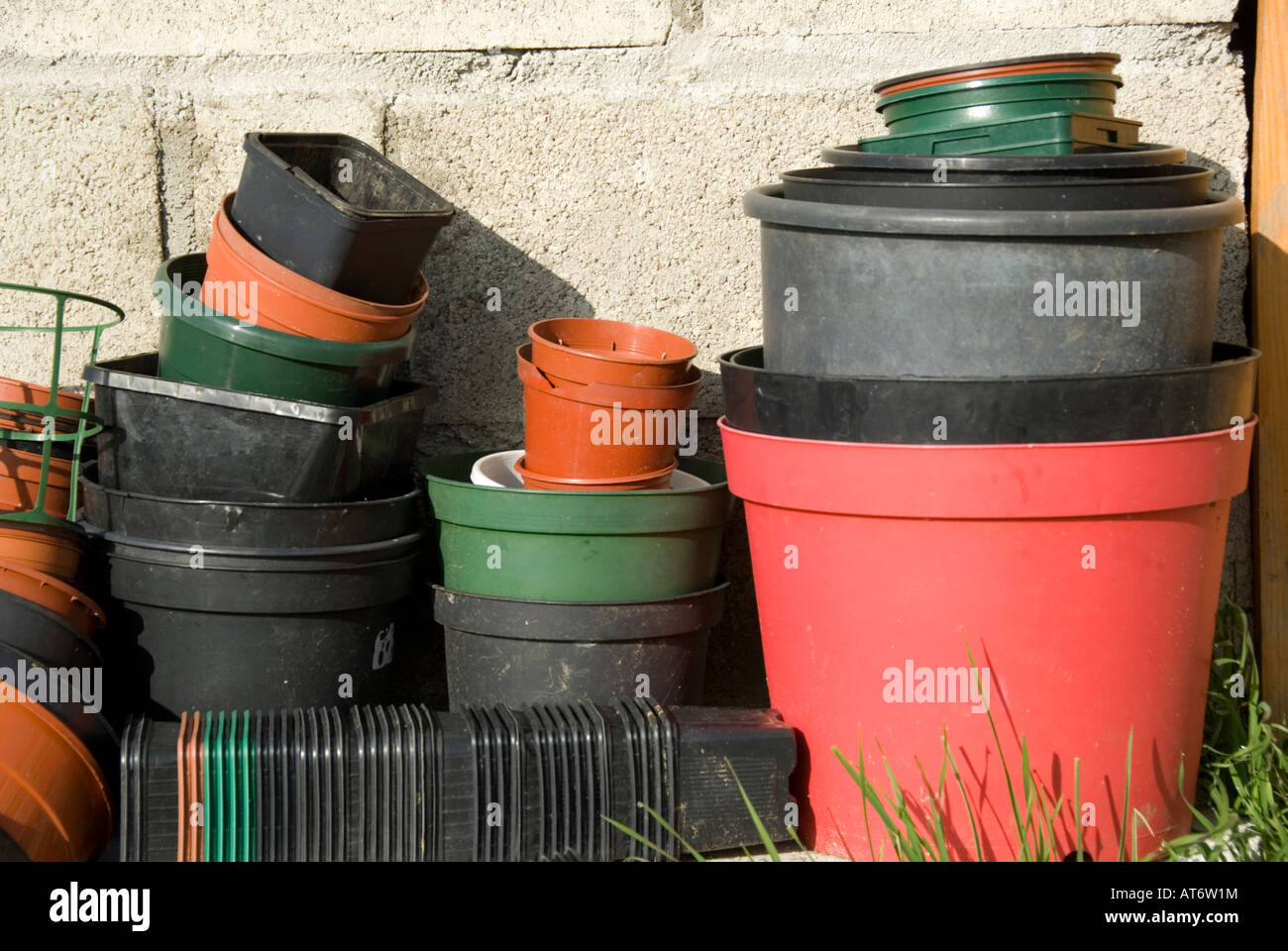 Pile of plastic flower pots in a garden Stock Photo - Alamy
