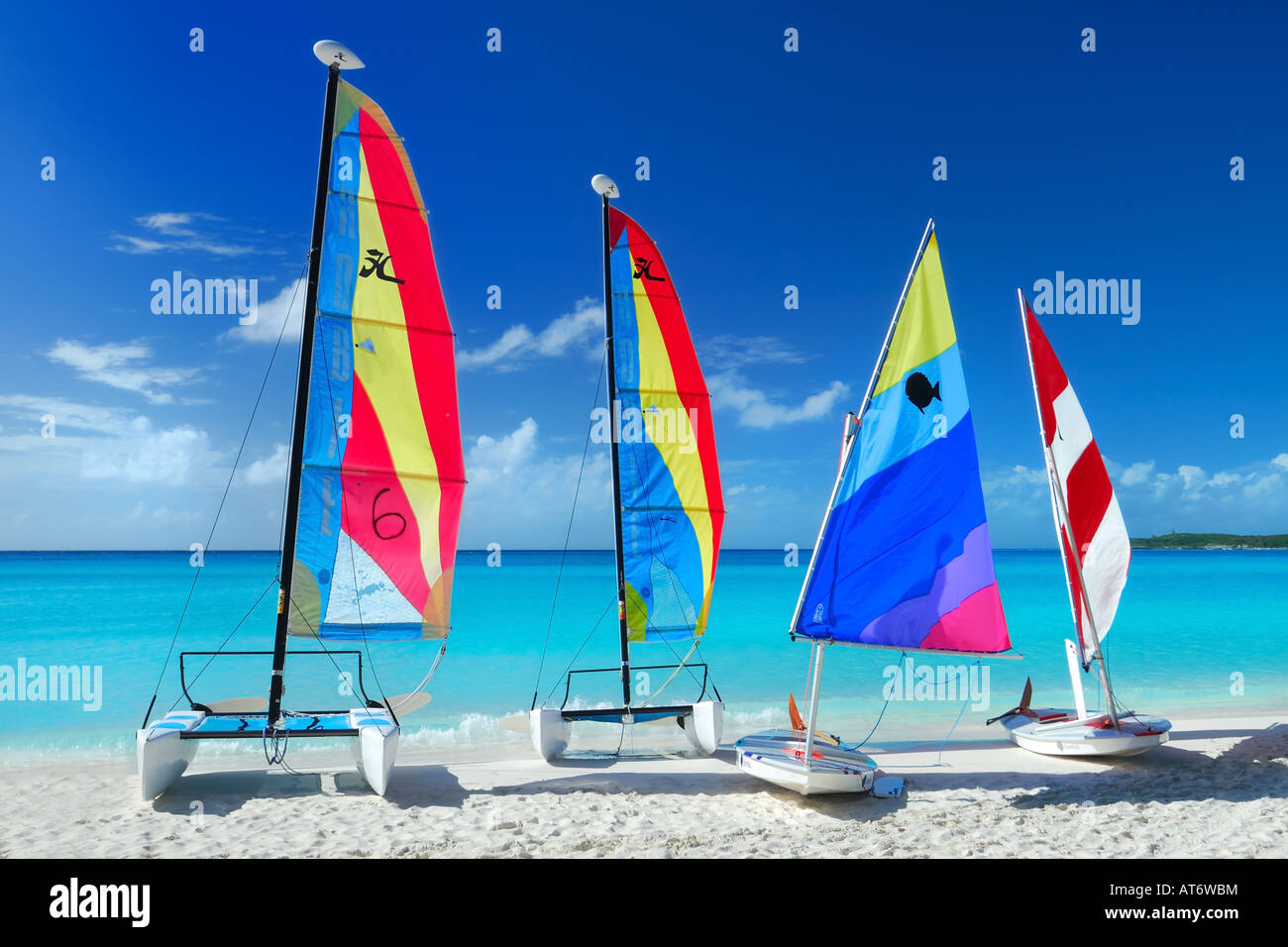 Colorful sailboats on a tropical white sand beach paradise Stock Photo ...