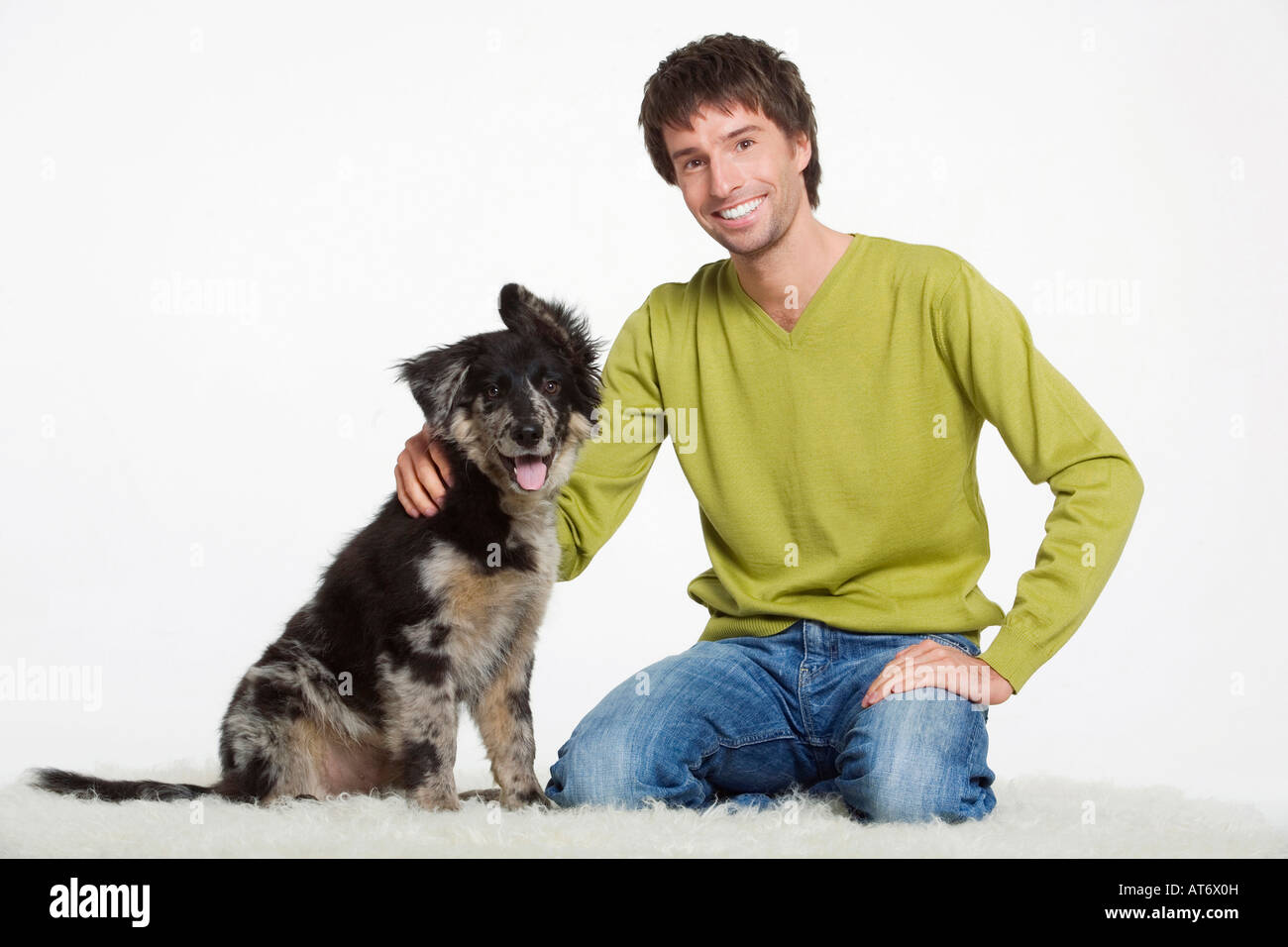 Young man with dog, portrait Stock Photo - Alamy