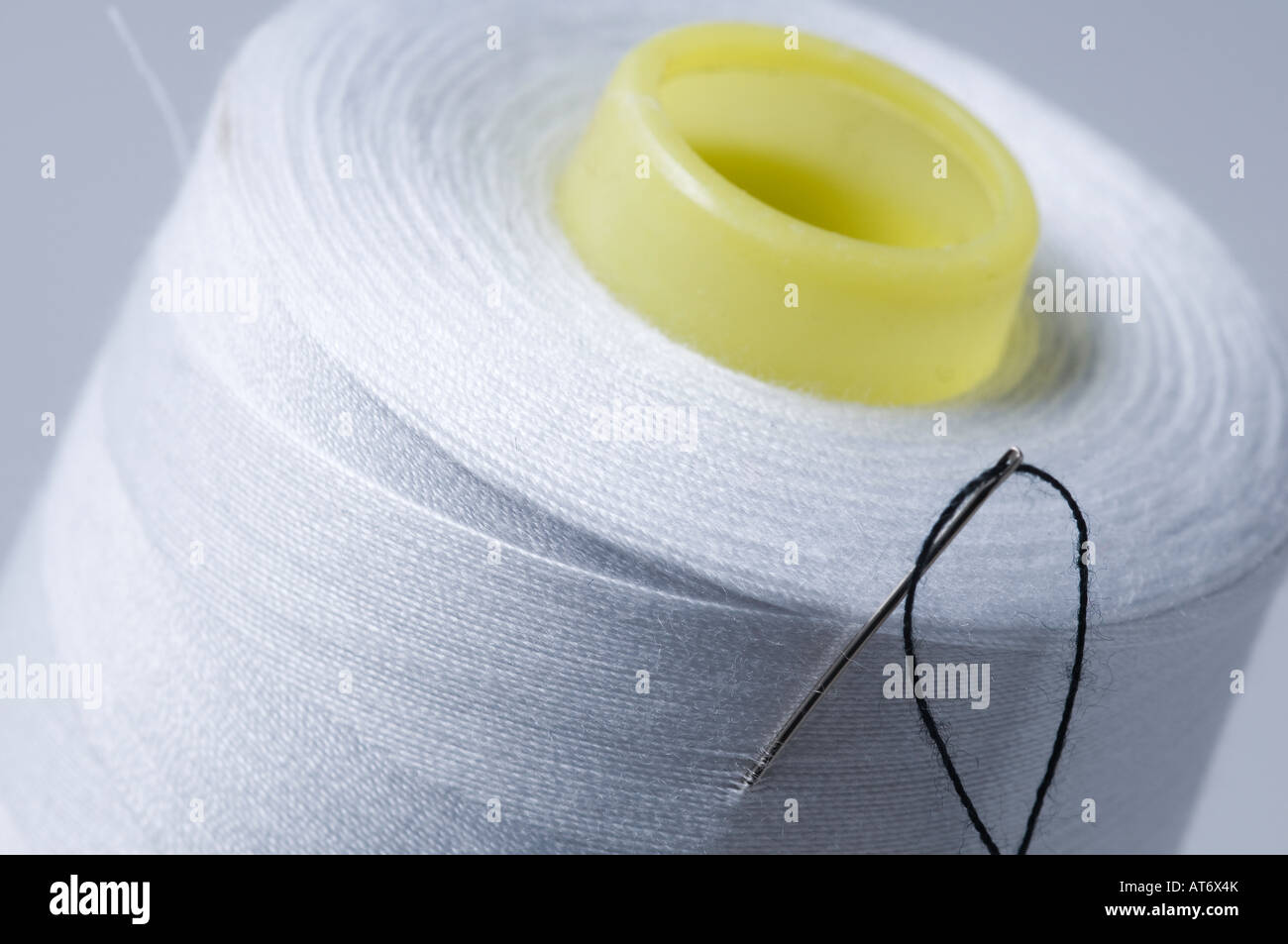 spools of white sewing thread Stock Photo - Alamy
