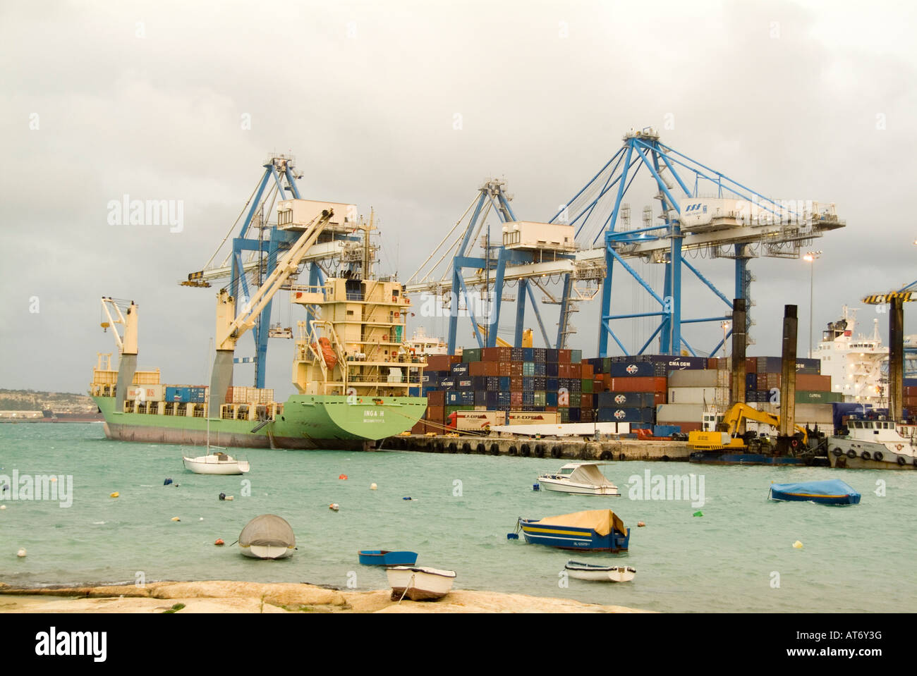 cargo ship dock docking crane freight boat deep Stock Photo - Alamy