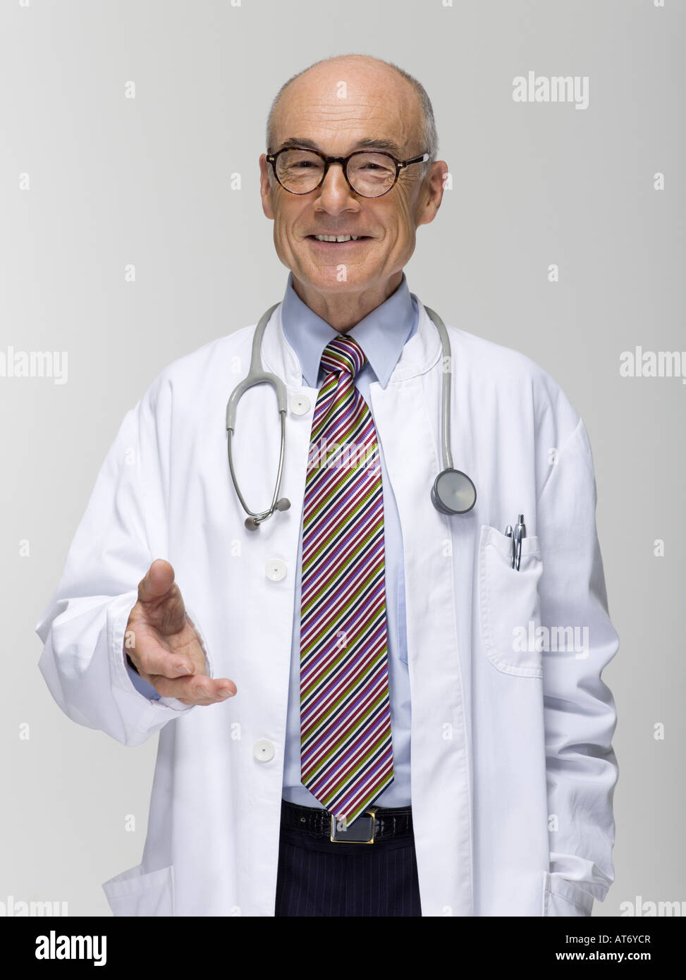 Senior male doctor gesturing, portrait Stock Photo - Alamy