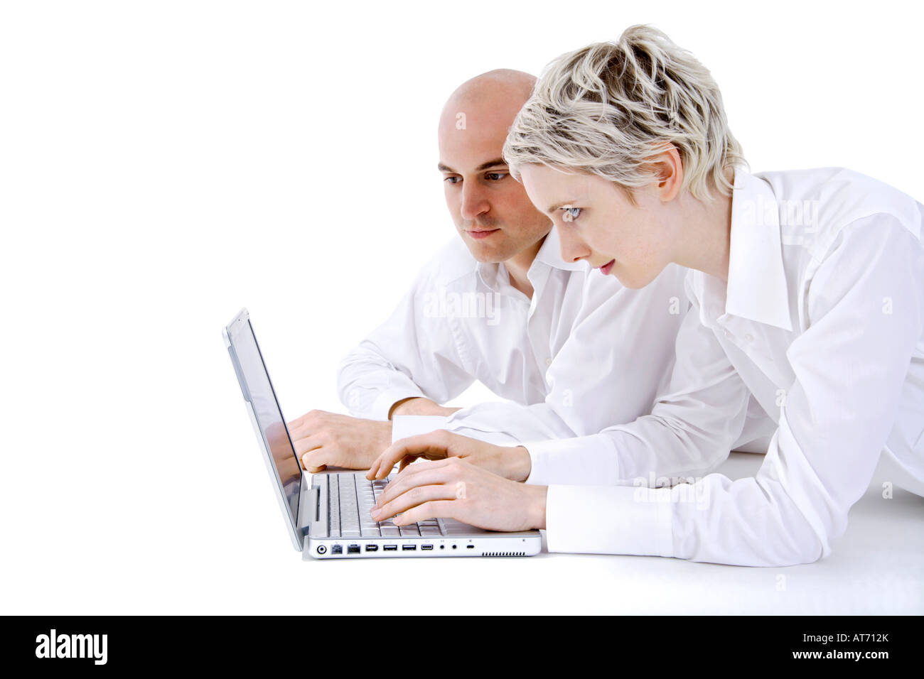 Young couple using laptop, portrait Stock Photo - Alamy