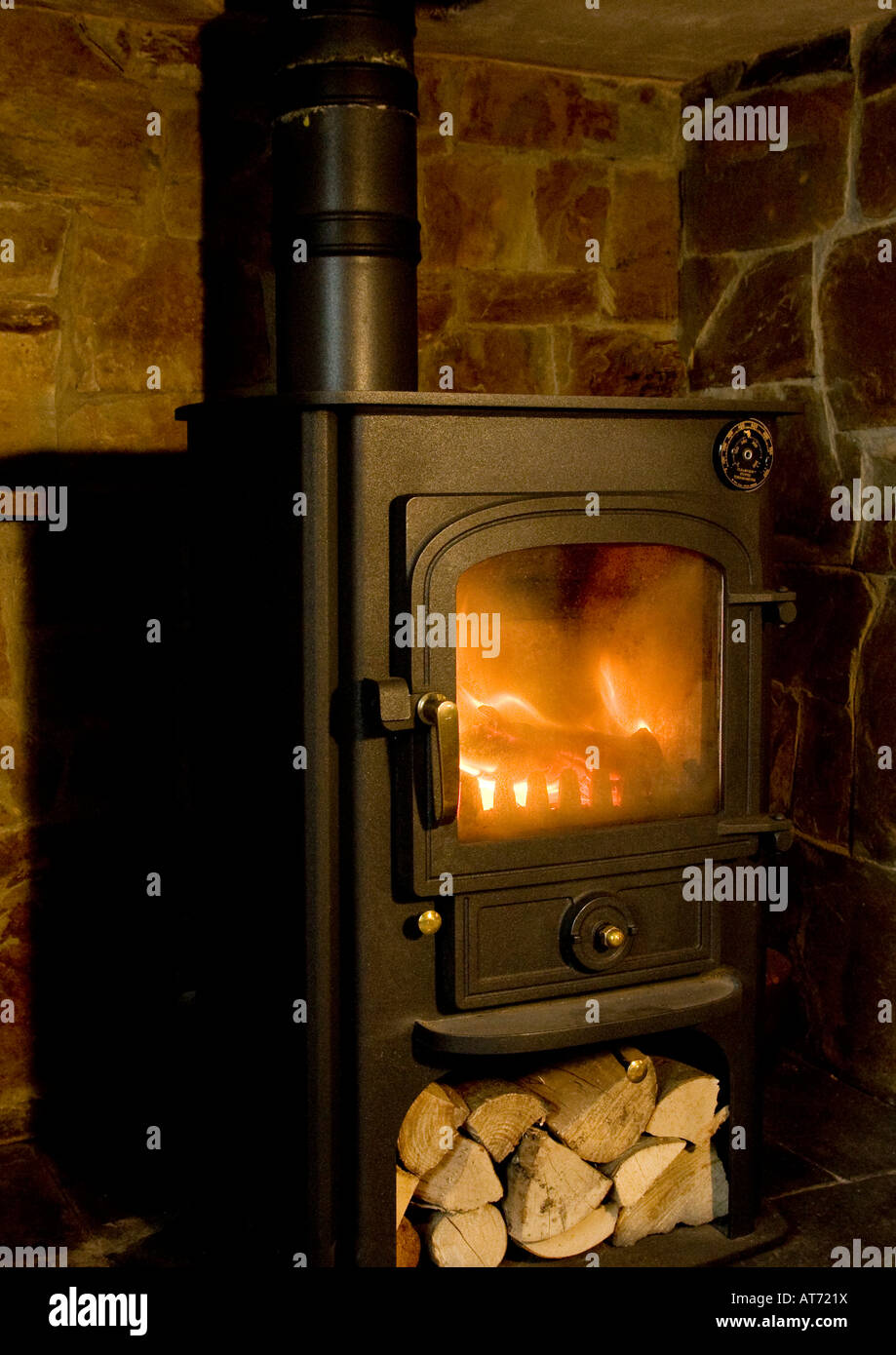 Woodburning stove with flames Stock Photo - Alamy