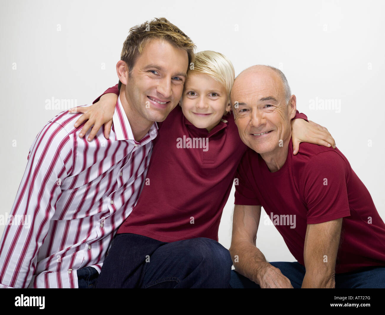 Grandson (8-9) father and grandfather, smiling, portrait Stock Photo ...