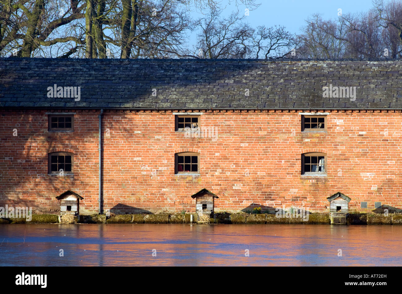 Ducks wooden nesting boxes at Shugborough Mill pond in Staffordshire ...