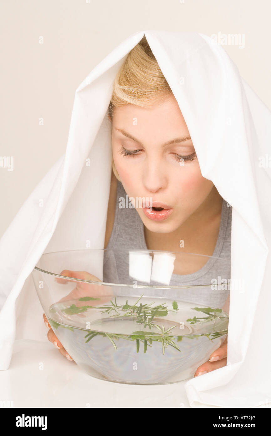 Young woman inhaling vapors, portrait Stock Photo - Alamy