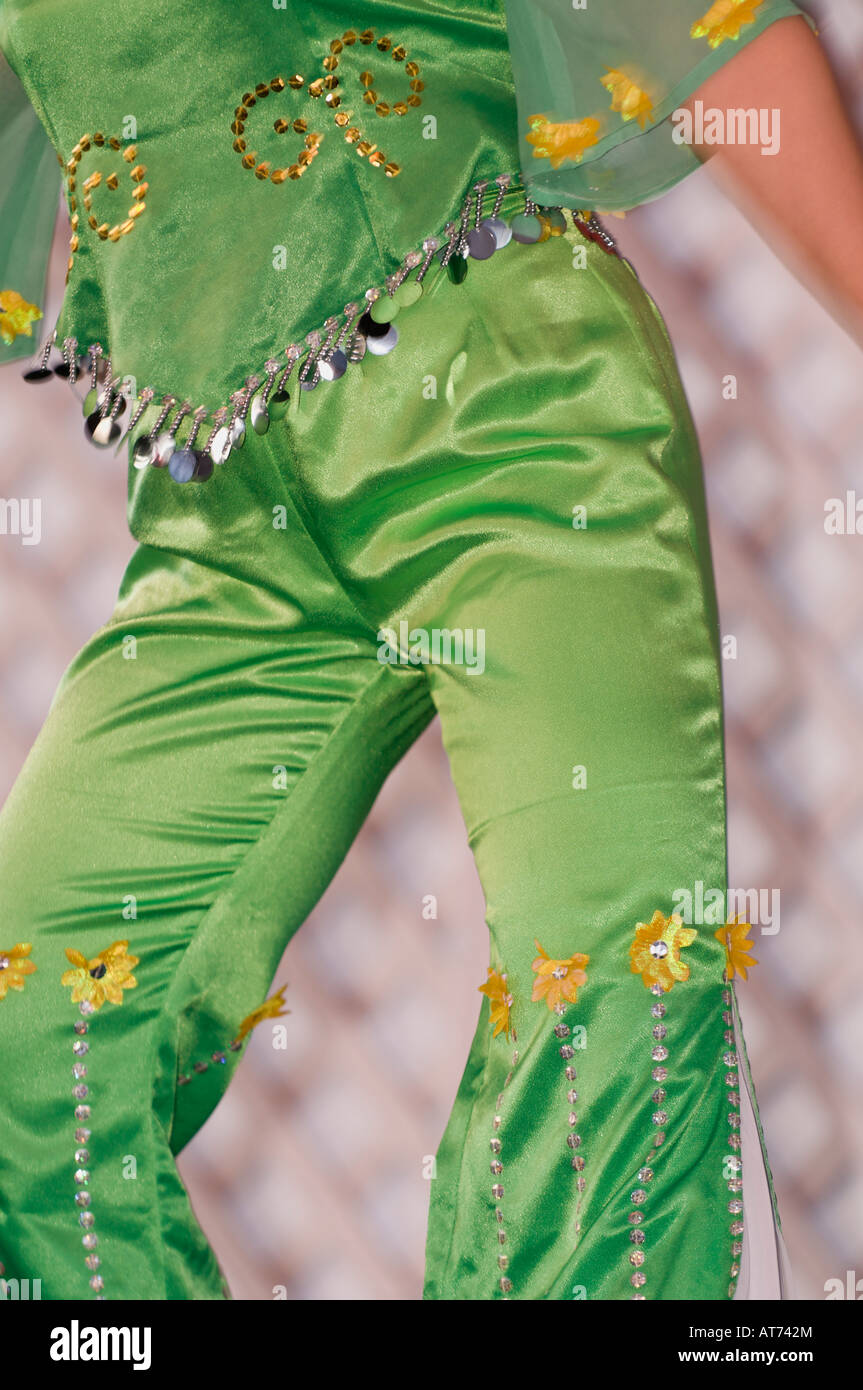 Woman dancing in green costume Stock Photo - Alamy