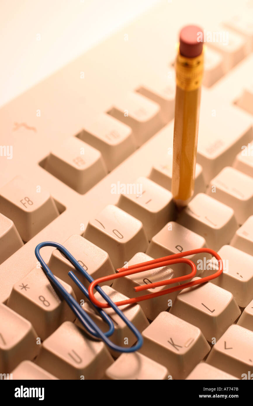 Pencil and Paperclips on Computer Keyboard Stock Photo - Alamy
