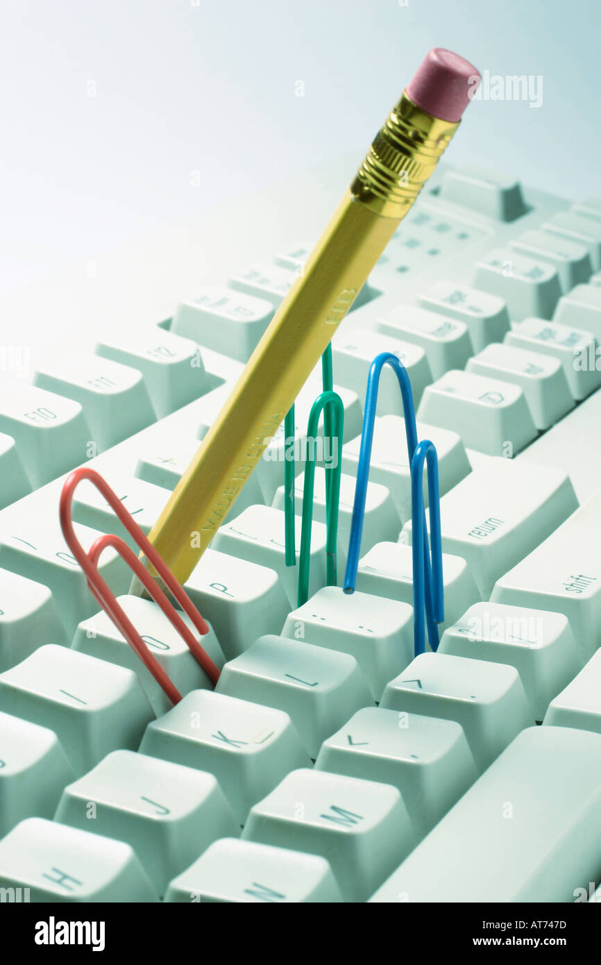 Pencil and Paperclips on Computer Keyboard Stock Photo - Alamy