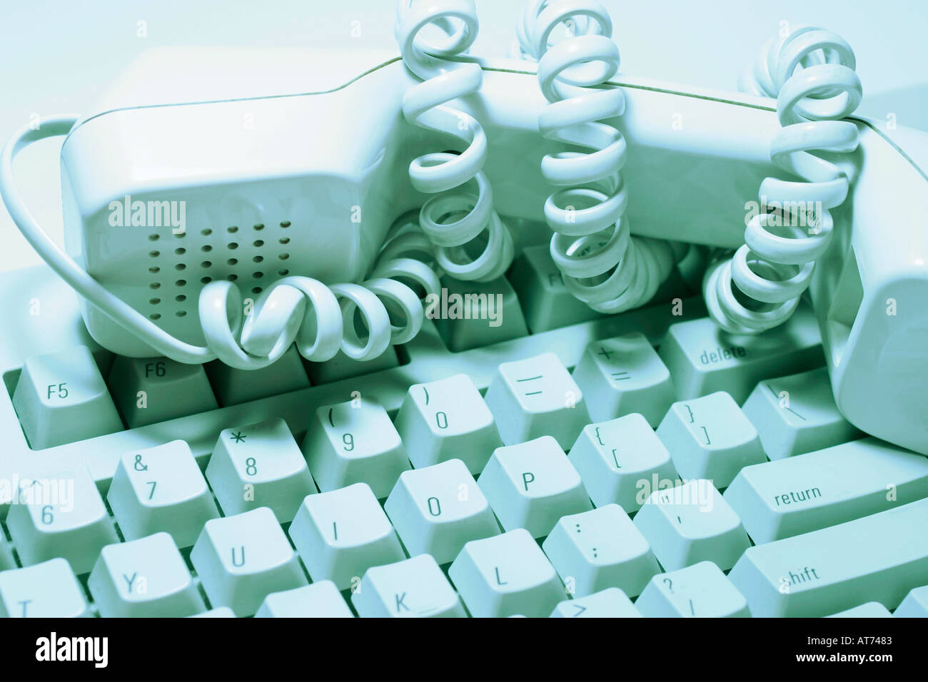 Phone Receiver on Computer Keyboard Stock Photo - Alamy