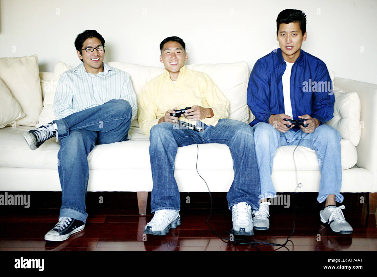 3 Men Playing Video Games Stock Photo - Alamy