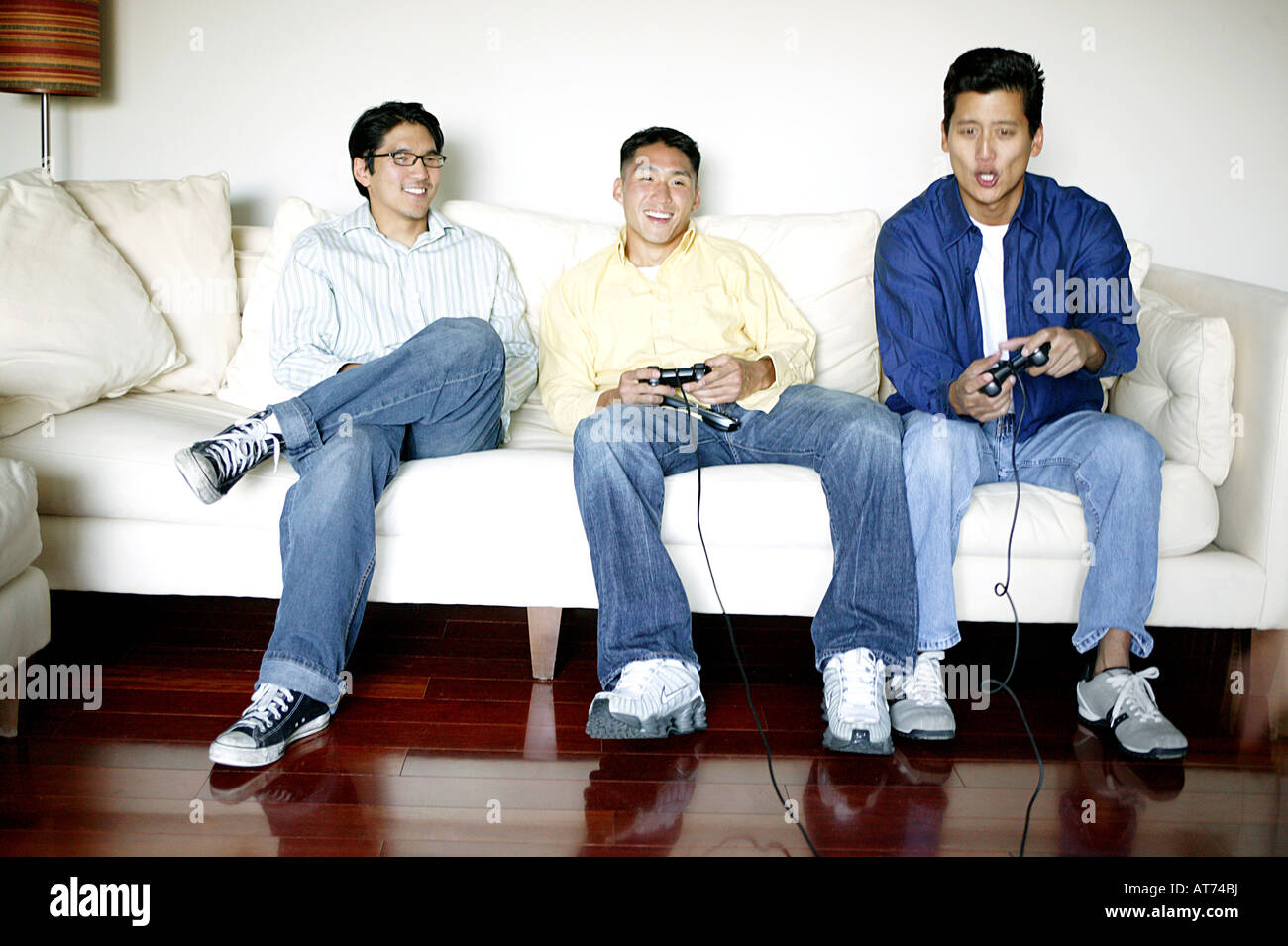 3 Men Playing Video Games Stock Photo - Alamy