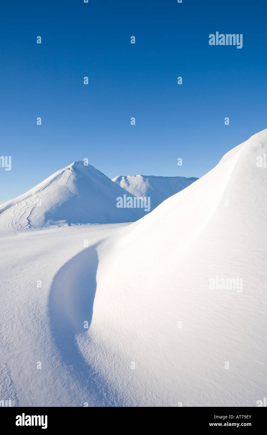 Wind formed patterns on a snow covered mounds at winter , Finland Stock ...