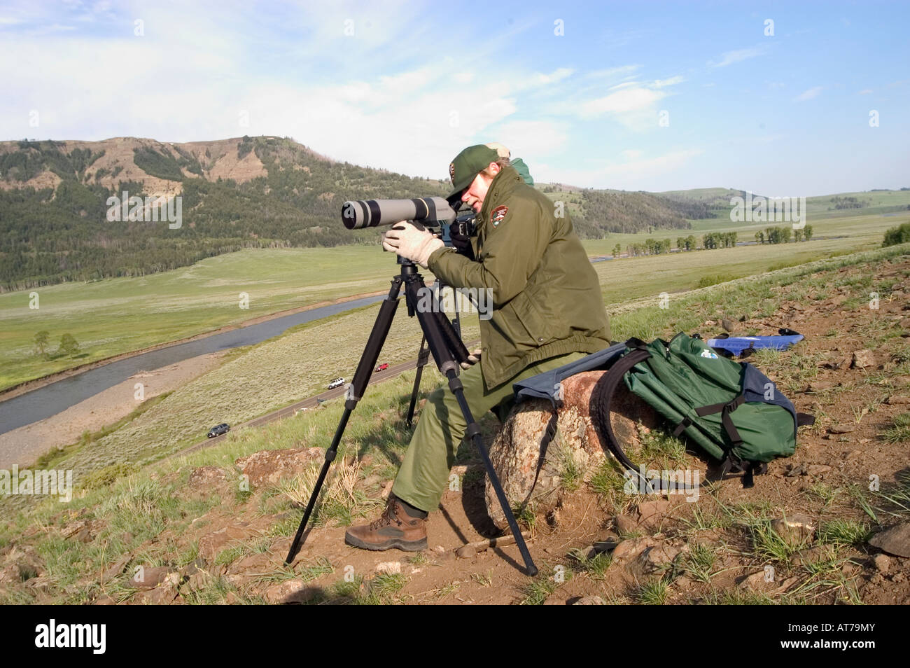 Wolf author Rick McIntyre uses a telescope to spot wolves in the Lamar ...