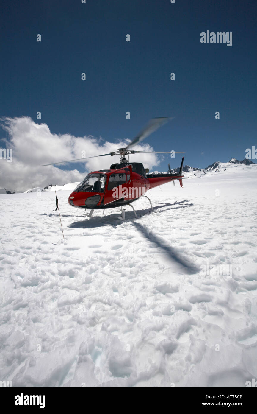 Helicopter landing on the snow, part of the grand tour exploring the ...