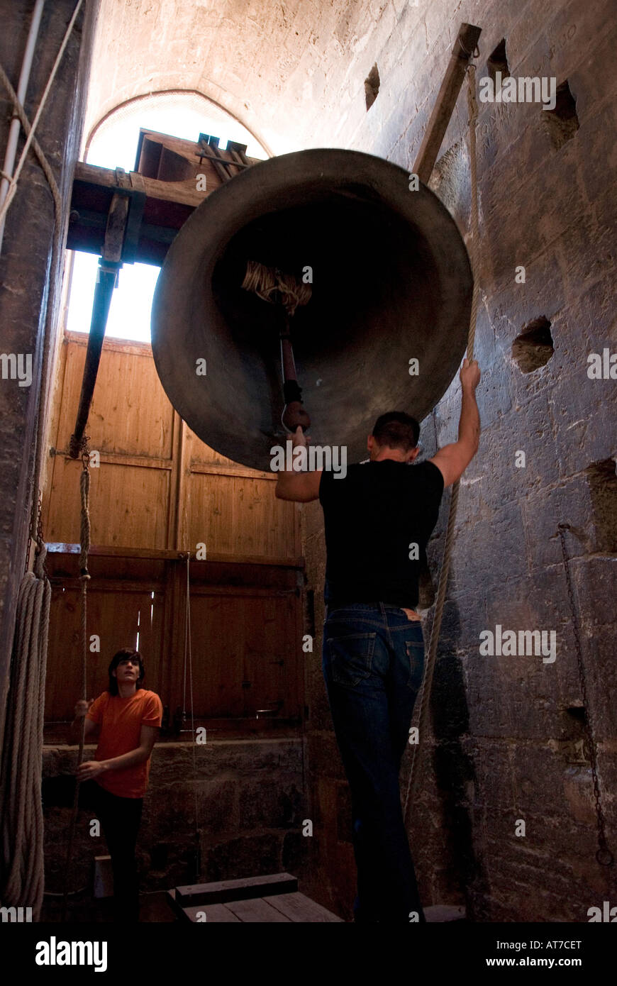 Bell ringer playing in the tower bell known as the Torre del Miguelete ...