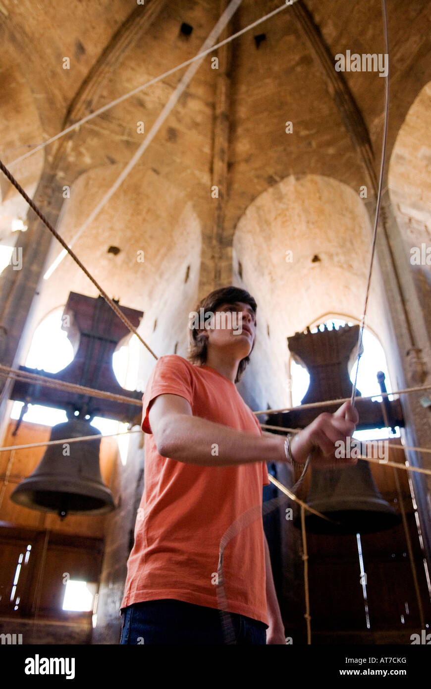 Bell ringer playing in the tower bell known as the Torre del Miguelete ...