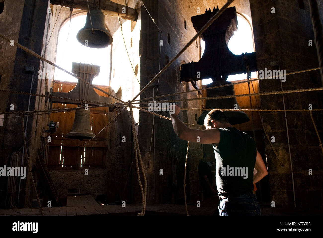 Bell ringer playing in the tower bell known as the Torre del Miguelete ...