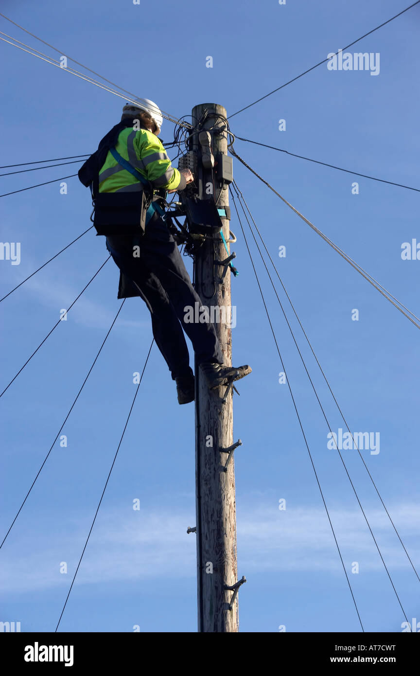Wire climbing climb phone line working british telecom hi-res stock ...