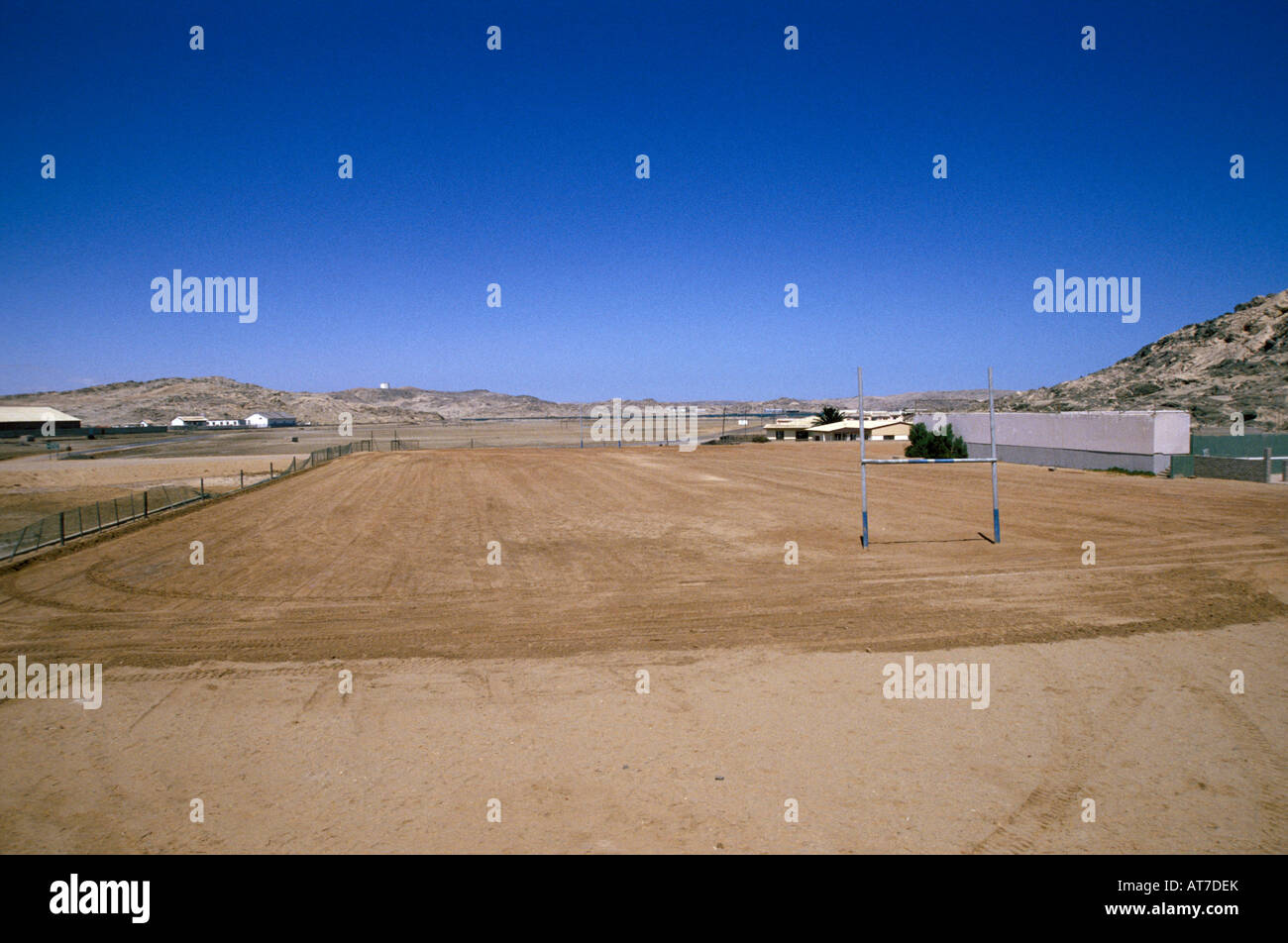 Hard sand surface of football and rugby pitch , Kolmanskop , Namibia ...