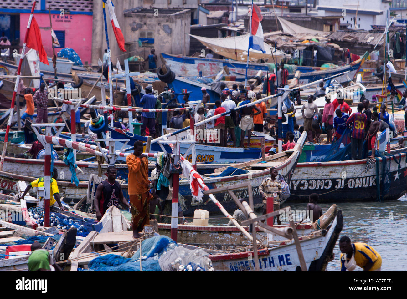 A colorful display of Ghanain fishing boats at port in Elmina after a ...