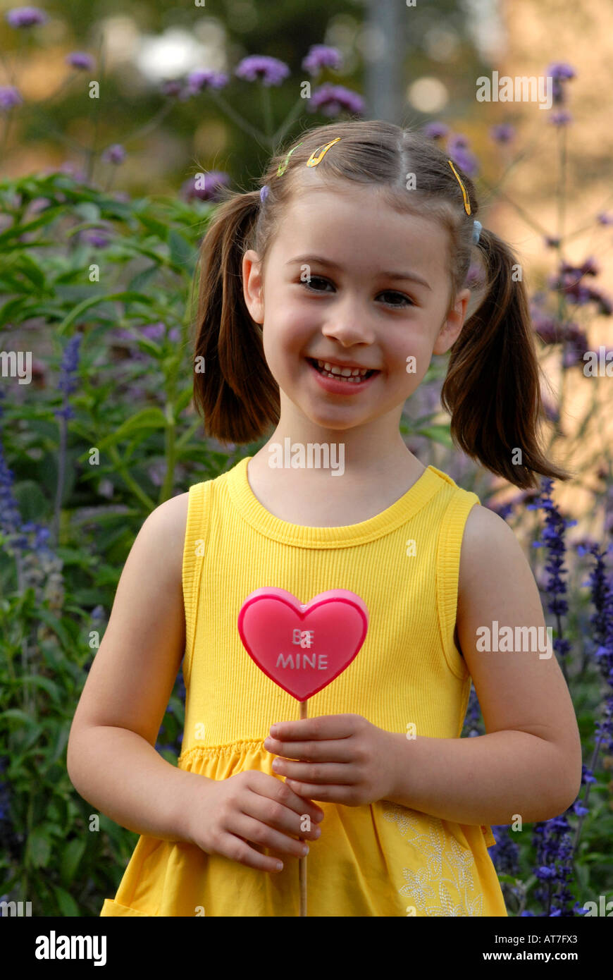 Girl with heart Stock Photo - Alamy