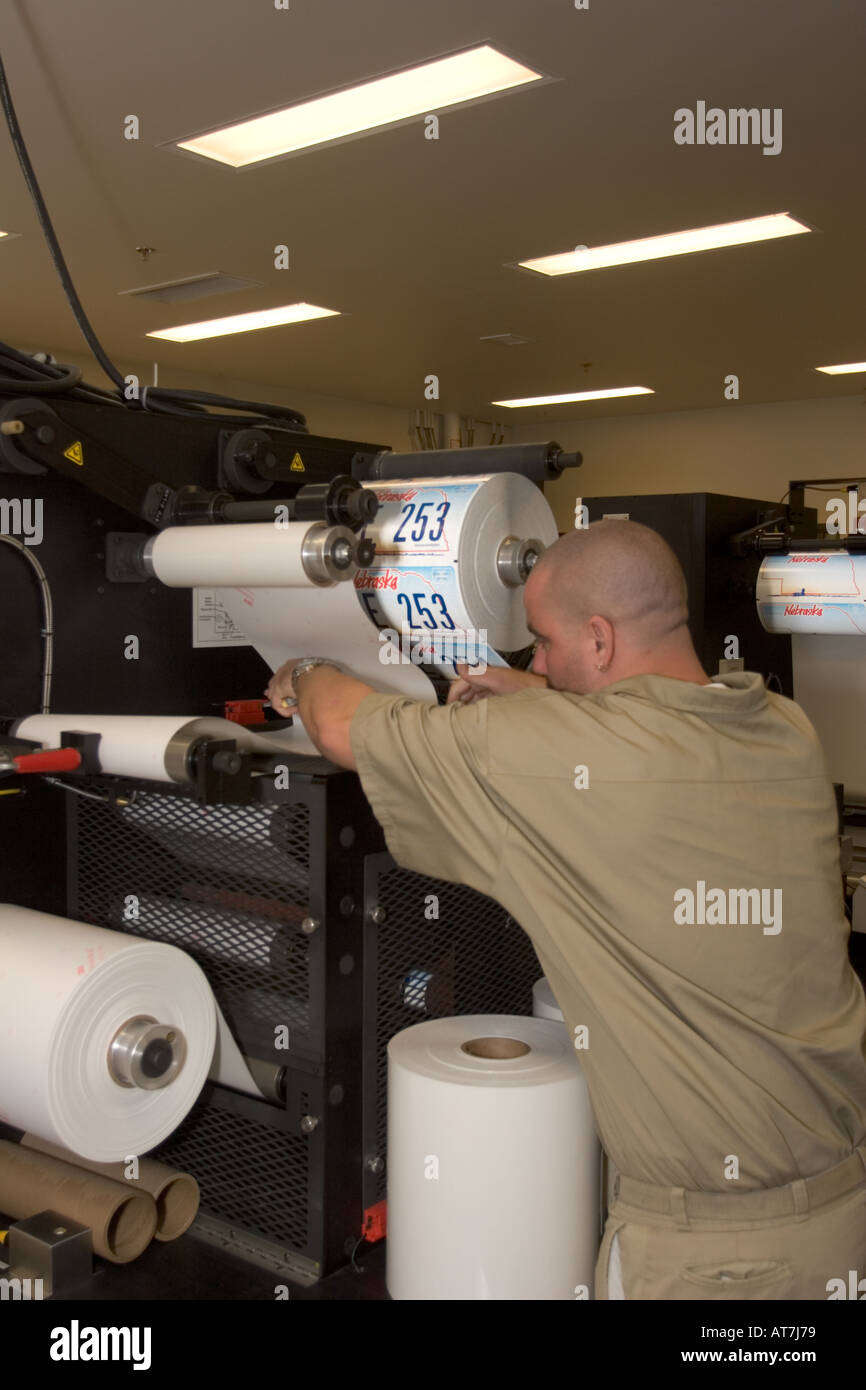 License plate manufacturing Replacing empty roll in printing machine ...