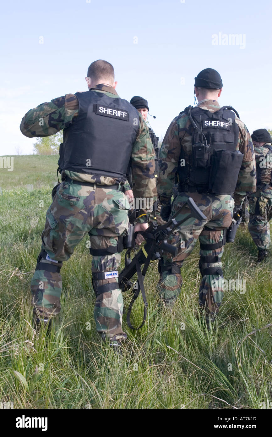 SWAT team getting ready to make entry to serve search warrant. Training ...