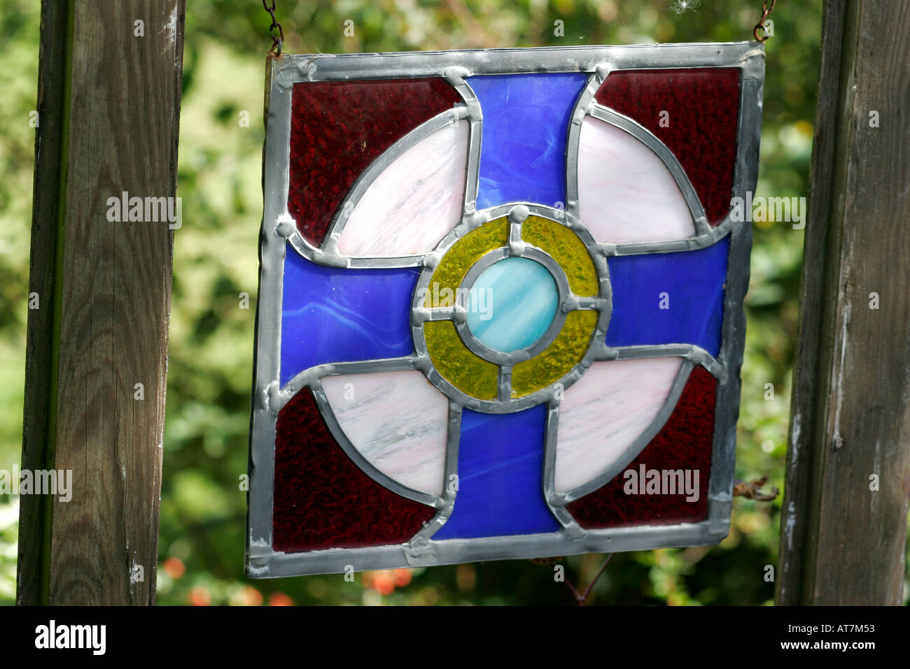 Decorative stained glass panels hanging inside a wooden frame Stock ...
