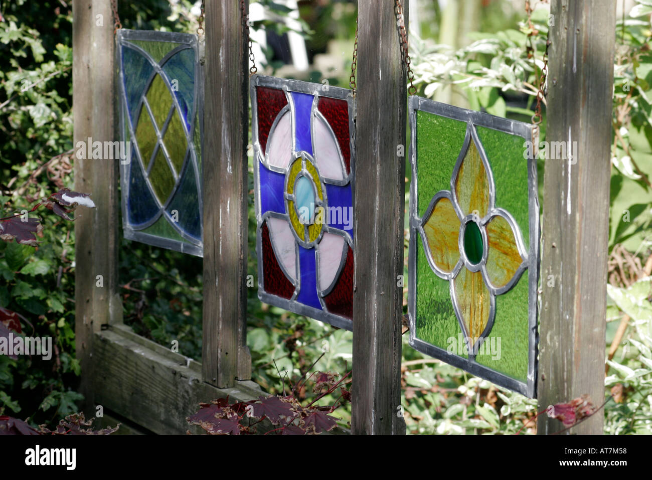 Decorative stained glass panels hanging inside a wooden frame Stock ...