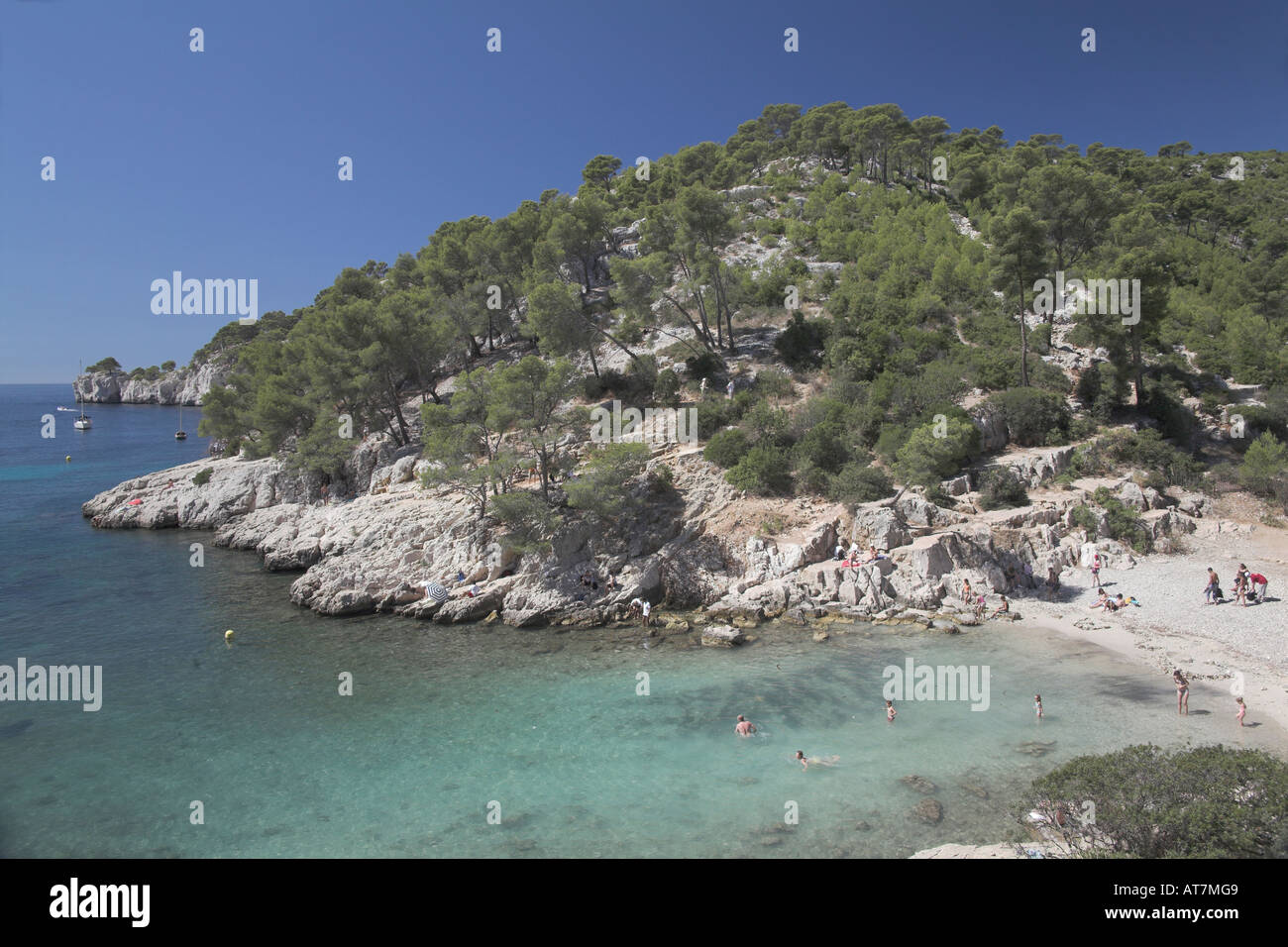 Stock photograph of Port Pin Calanque beach limestone cliffs between ...
