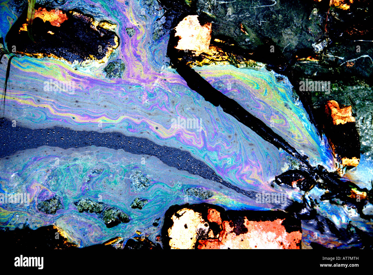 Oil on surface of stream makes abstract pattern pollution USA Stock ...