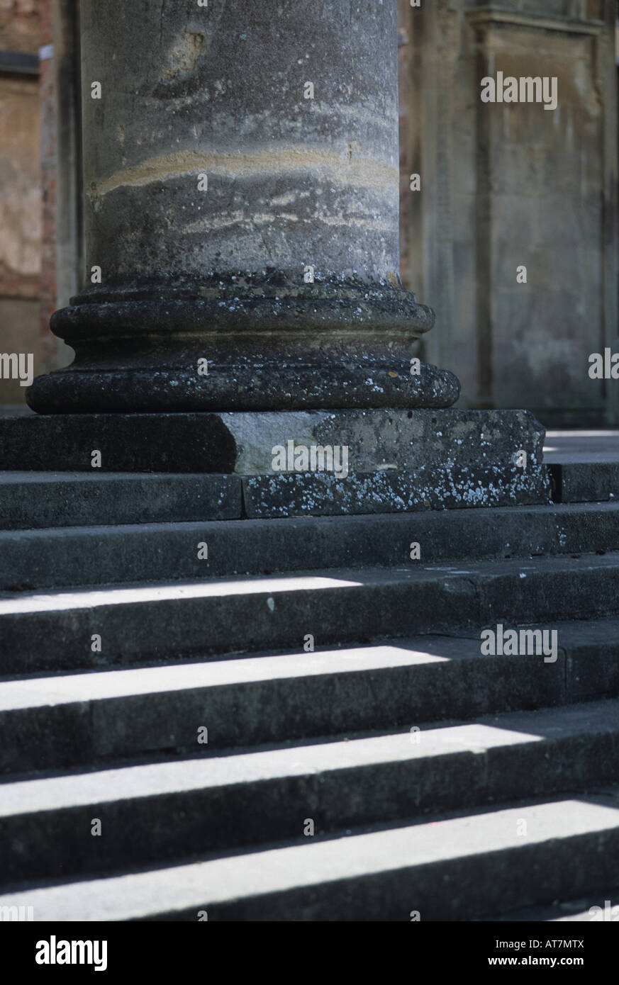 Stone steps and pillar highlighted by sunlight Stock Photo - Alamy