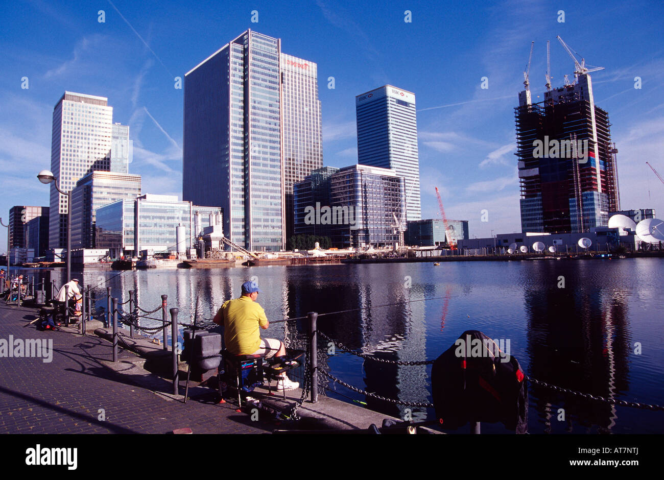 fishing london docklands england canary wharf office blocks reflections ...