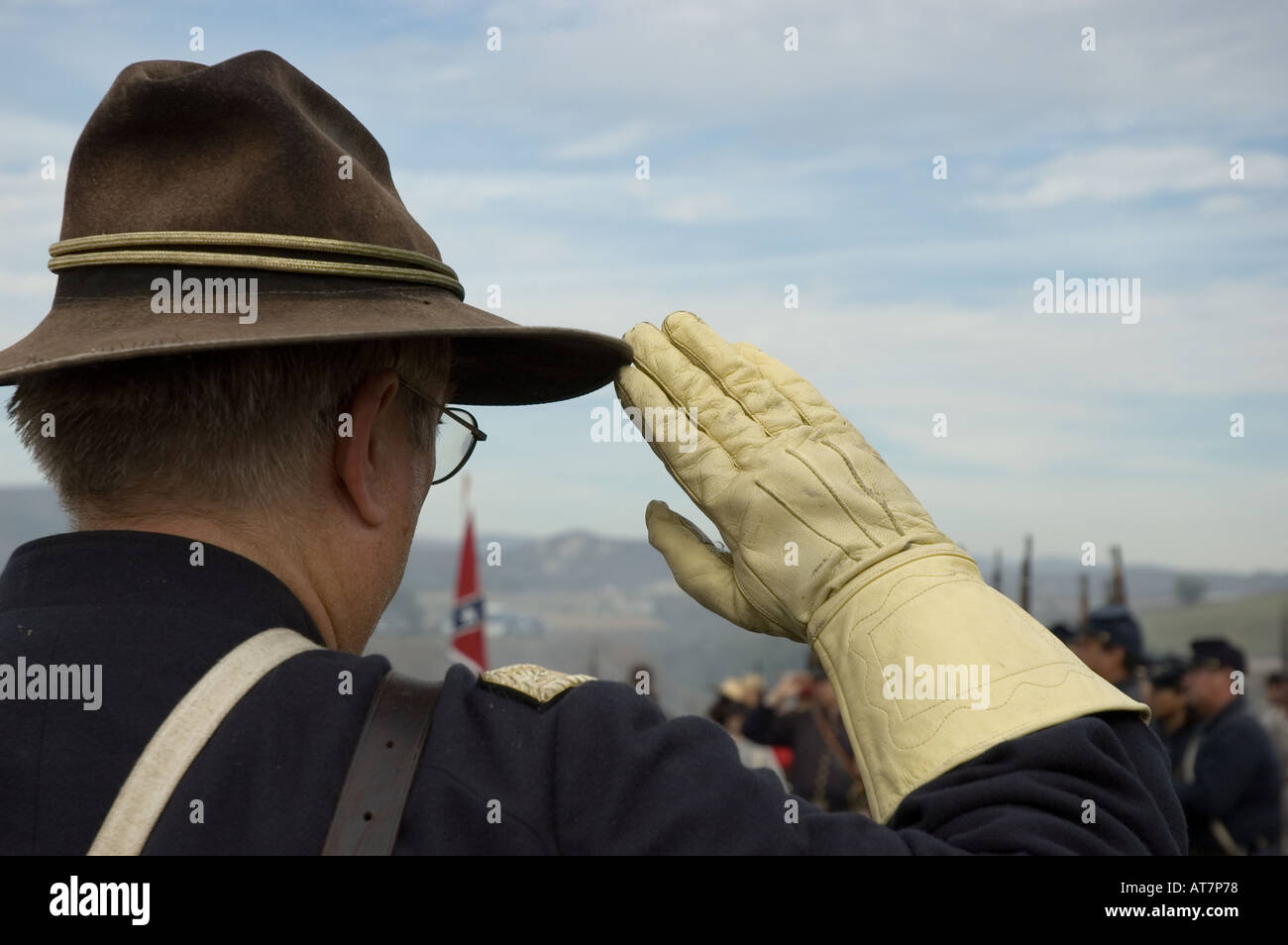Officer giving hand salute to the flag at Civil War reenactment event ...