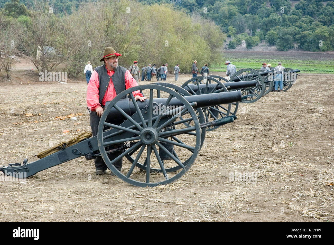 Cannoneer preparing for battle in cannon line at Civil War reenactment ...
